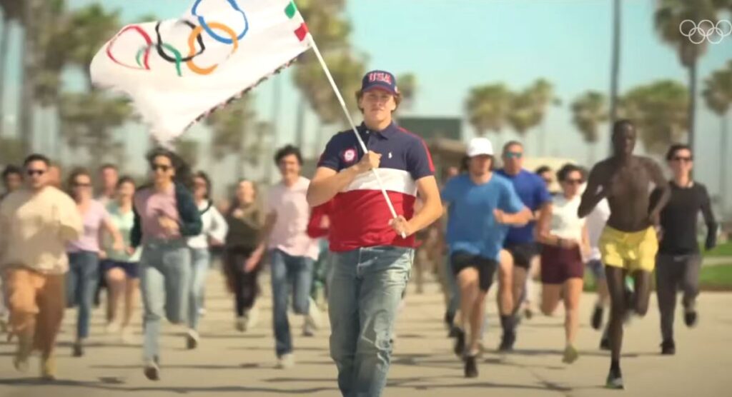 Olympic Silver Medalist Jagger Eaton Passes Flag From Paris 2024 to LA 2028